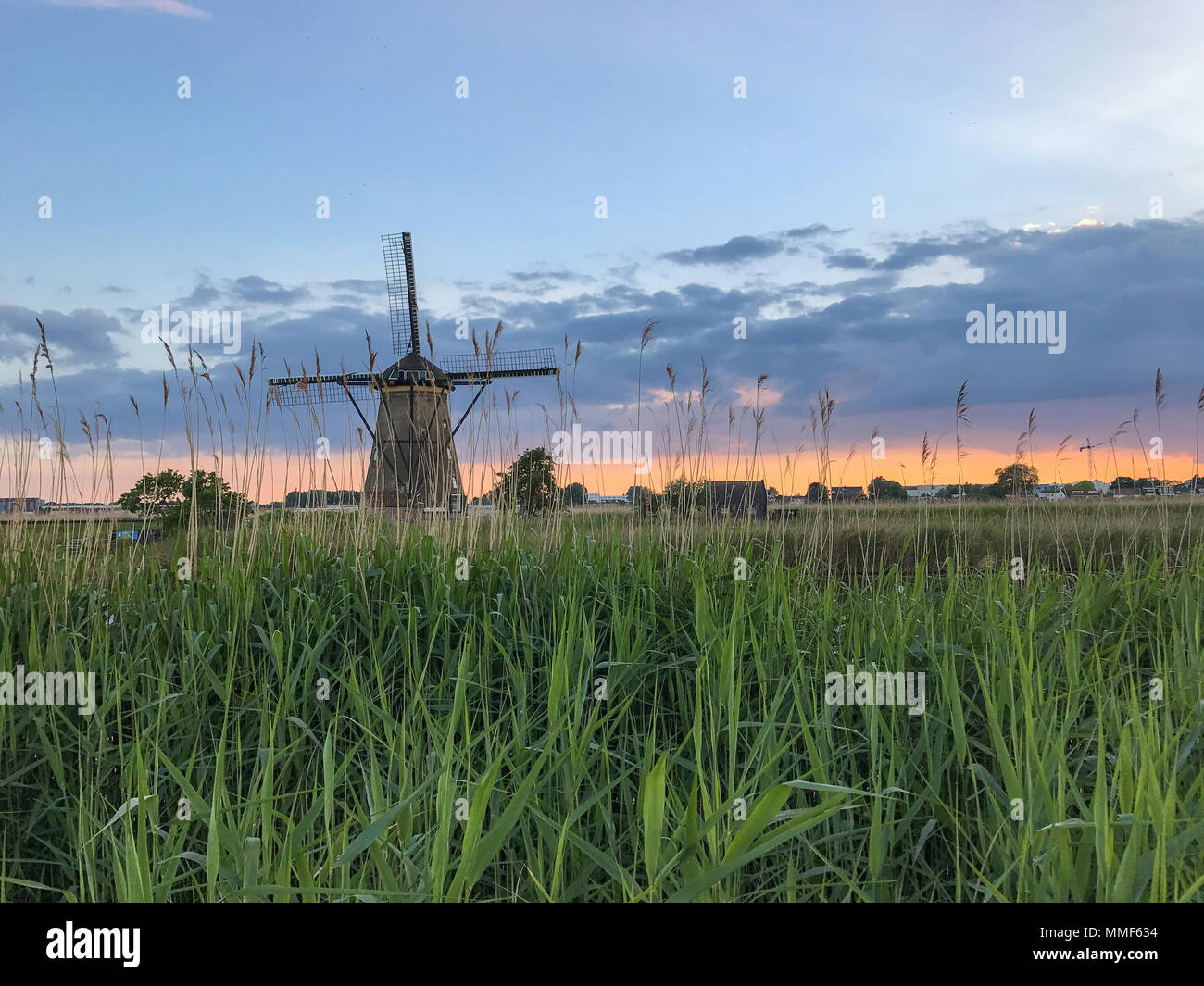 Beautiful dutch windmill landscape at the famous Kinderdijk canals ...
