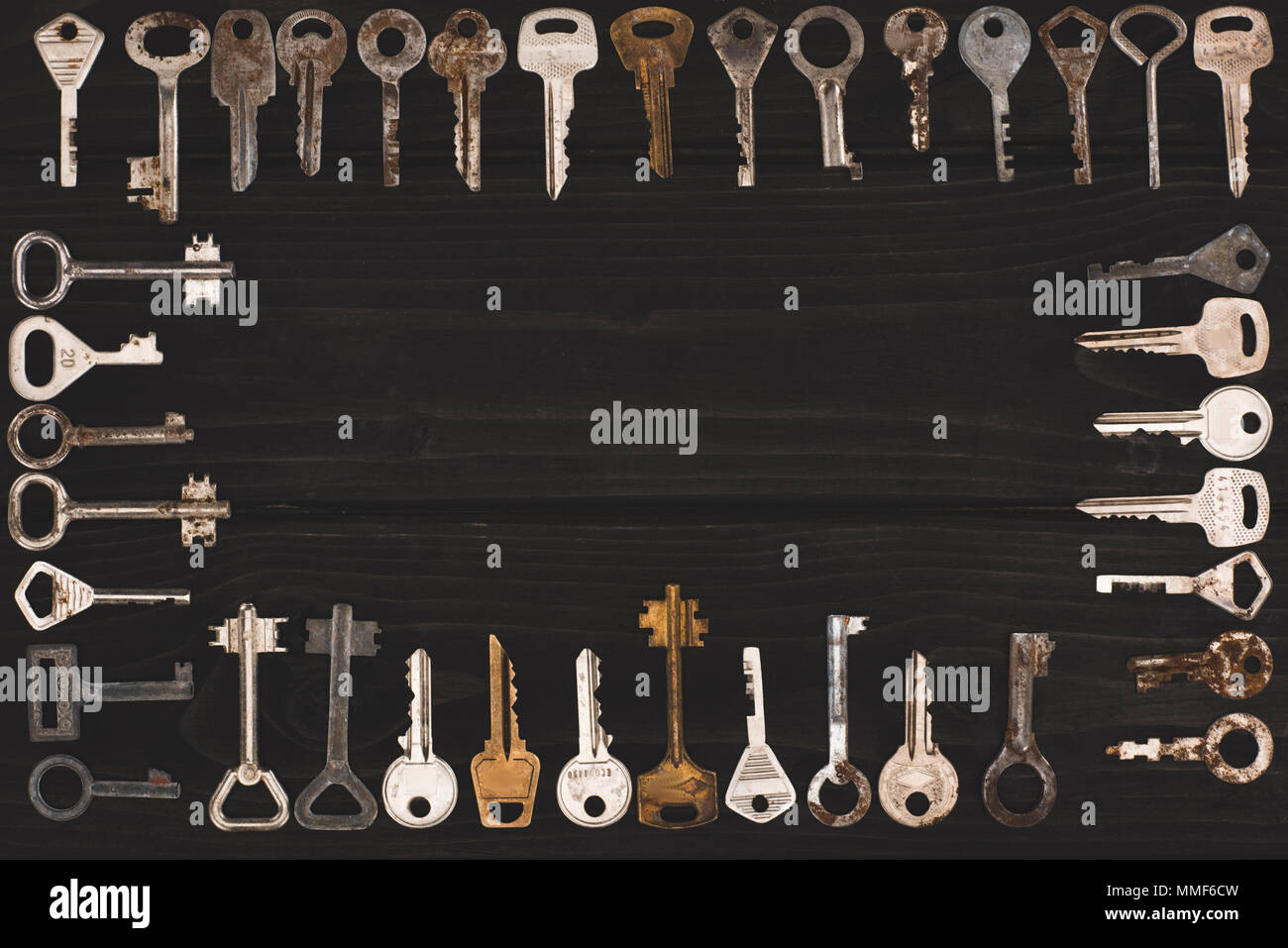 top view of vintage keys frame isolated on black Stock Photo - Alamy