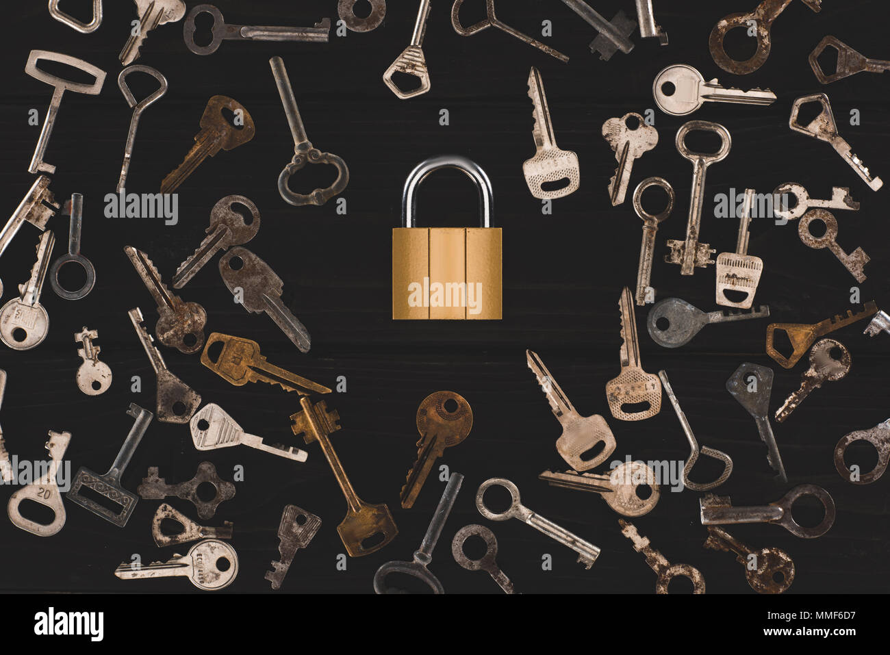 top view of different metal keys with lock isolated on black Stock ...