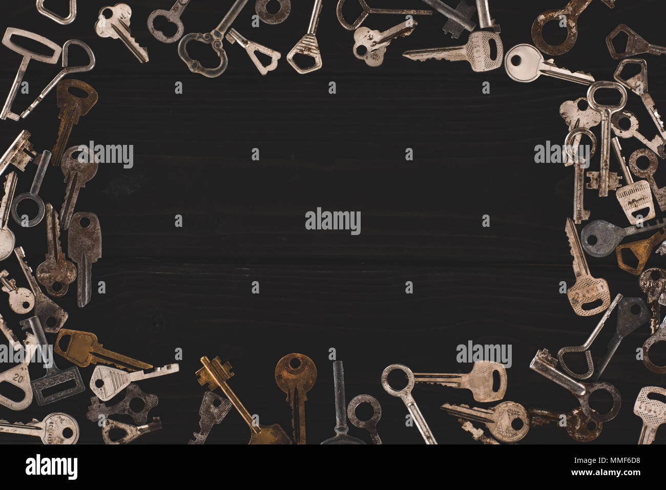 top view of vintage keys frame isolated on black Stock Photo - Alamy