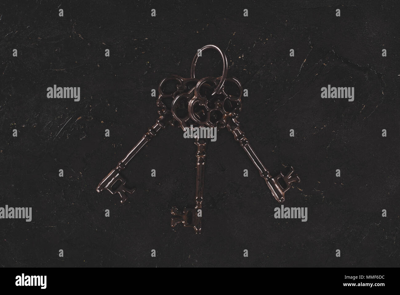 top view of vintage metal bunch of keys isolated on black Stock Photo ...