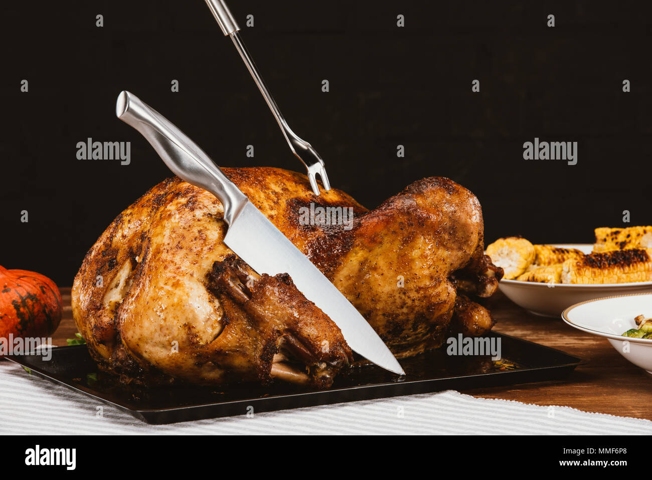 Baked turkey with fork and knife Stock Photo - Alamy