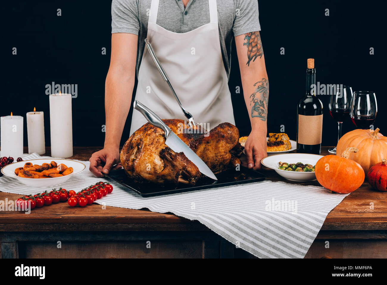 Man standing with baked turkey Stock Photo - Alamy
