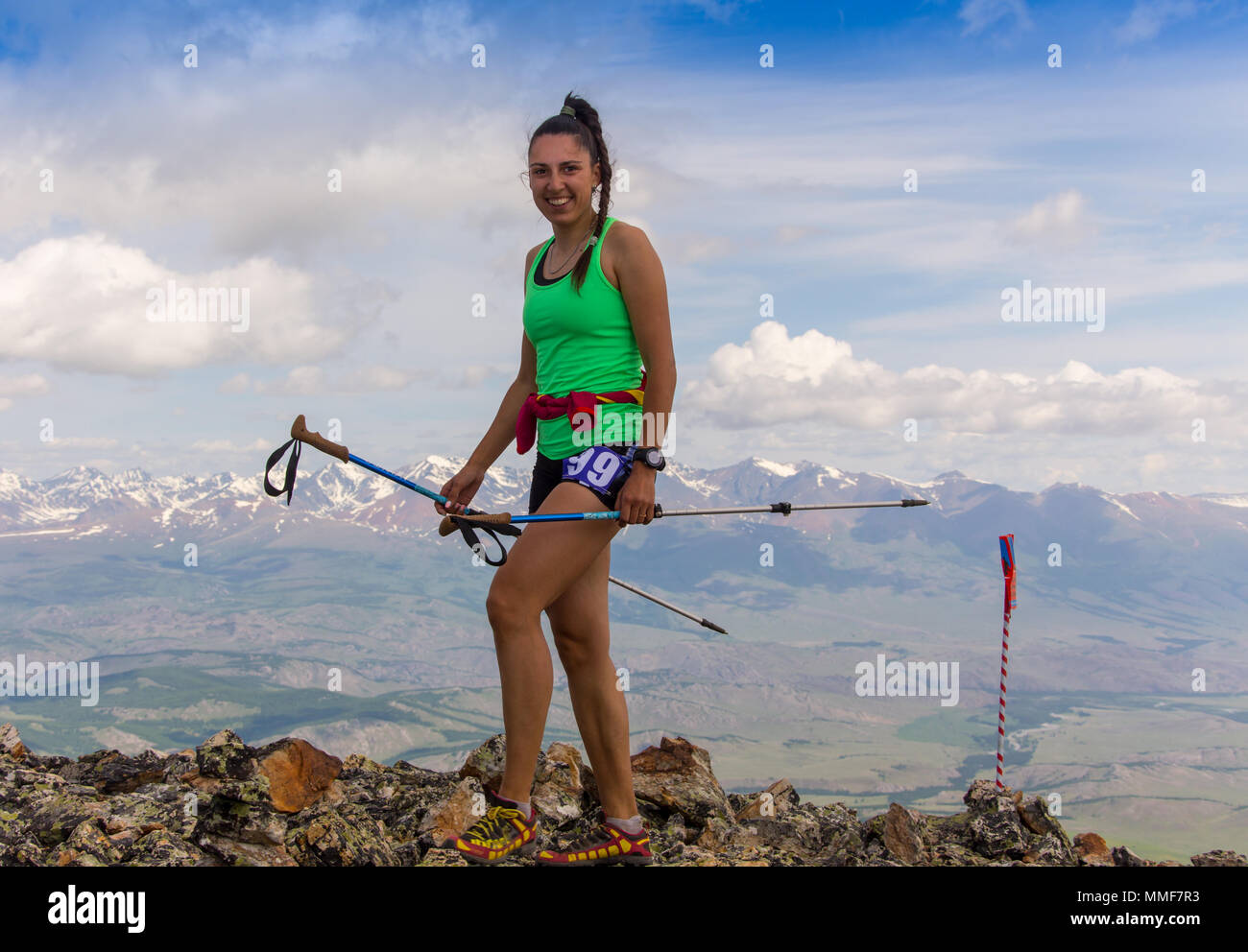 Female running in mountains under sunlight in Altay, Russia Stock Photo ...