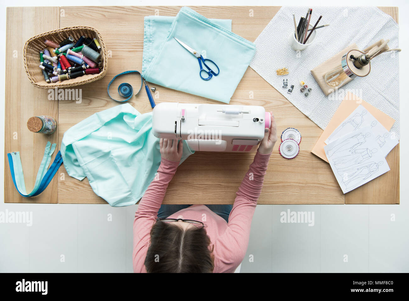 top view of woman seamstress at workplace with sewing machine Stock ...
