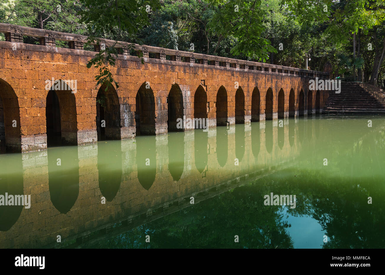 Bridge under the river in the parck in Cambodia Stock Photo - Alamy