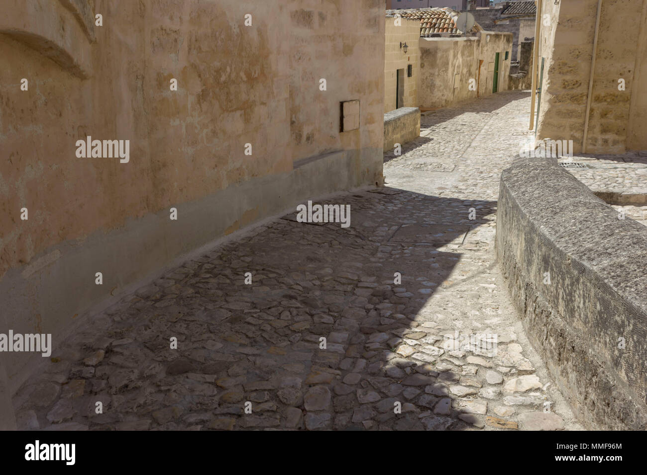 MATERA. ITALY - AUGUST 24 2017: Ancient pebbles street in Matera ...
