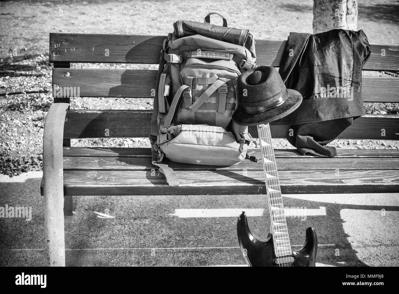 Free tramp lifestyle objects on a park bench Stock Photo - Alamy