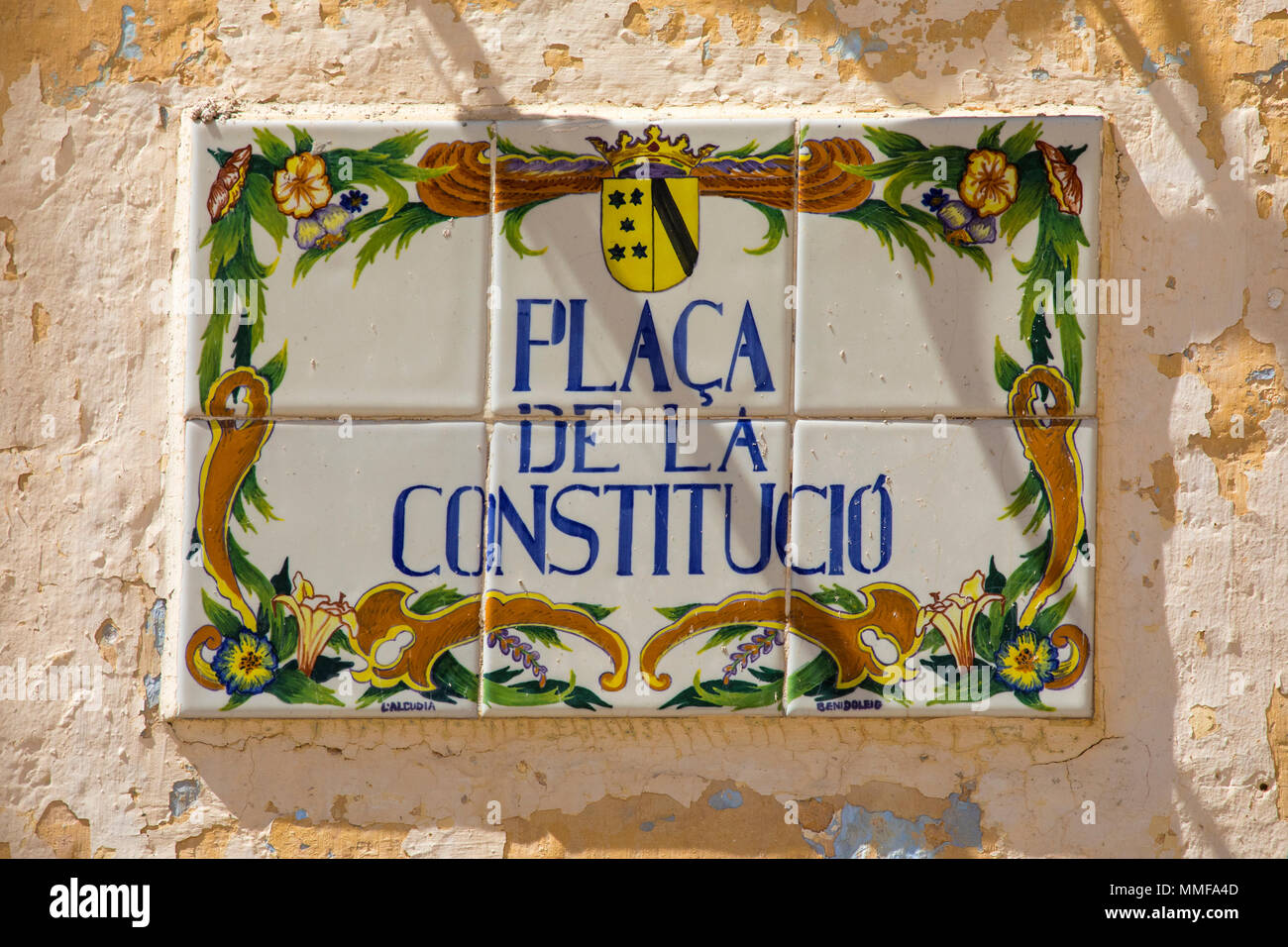 A close-up of the tiled street sign for Placa de la Constitucio - the ...