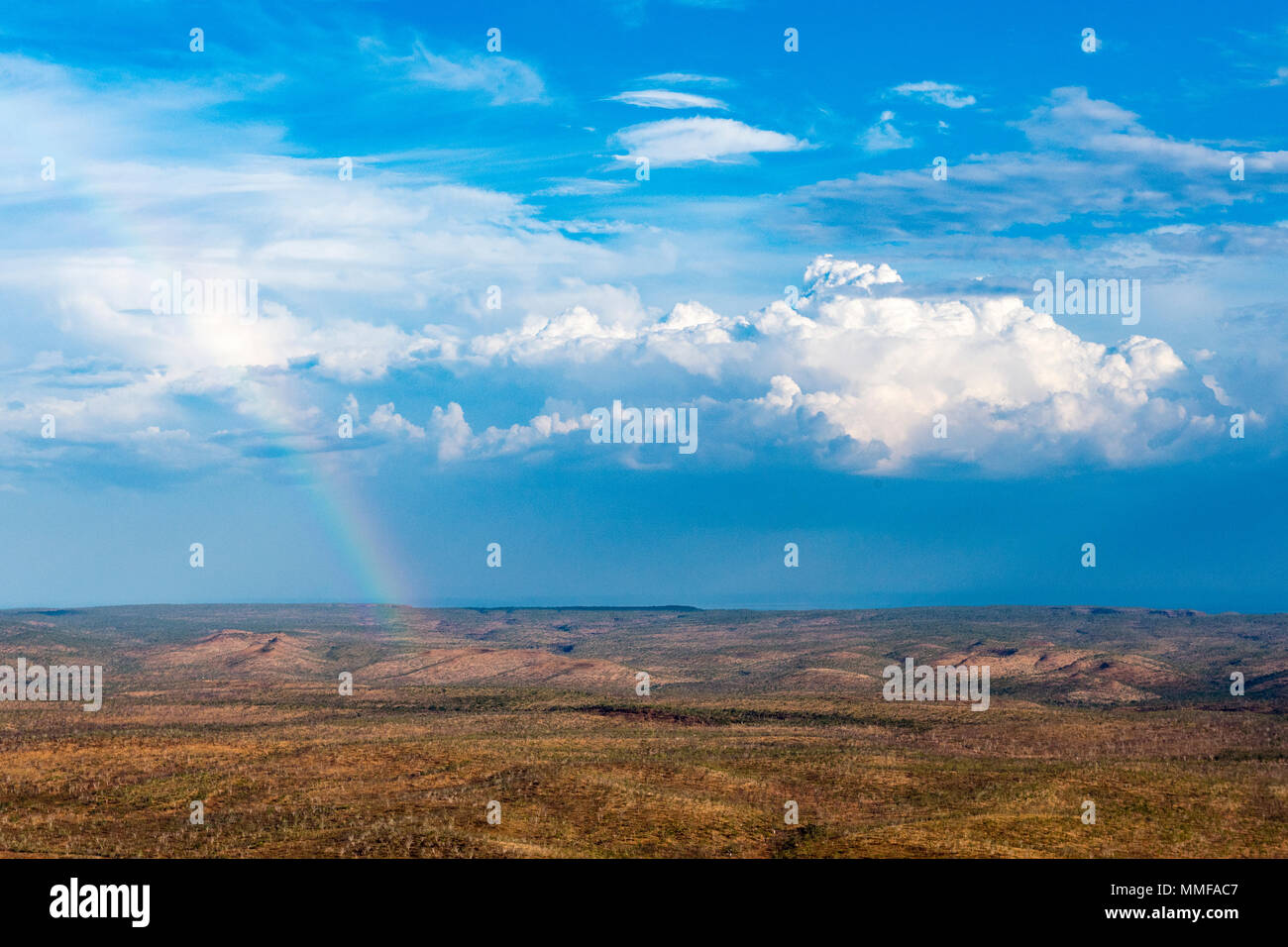 An aerial view of a vast arid outback cattle station with scattered ...