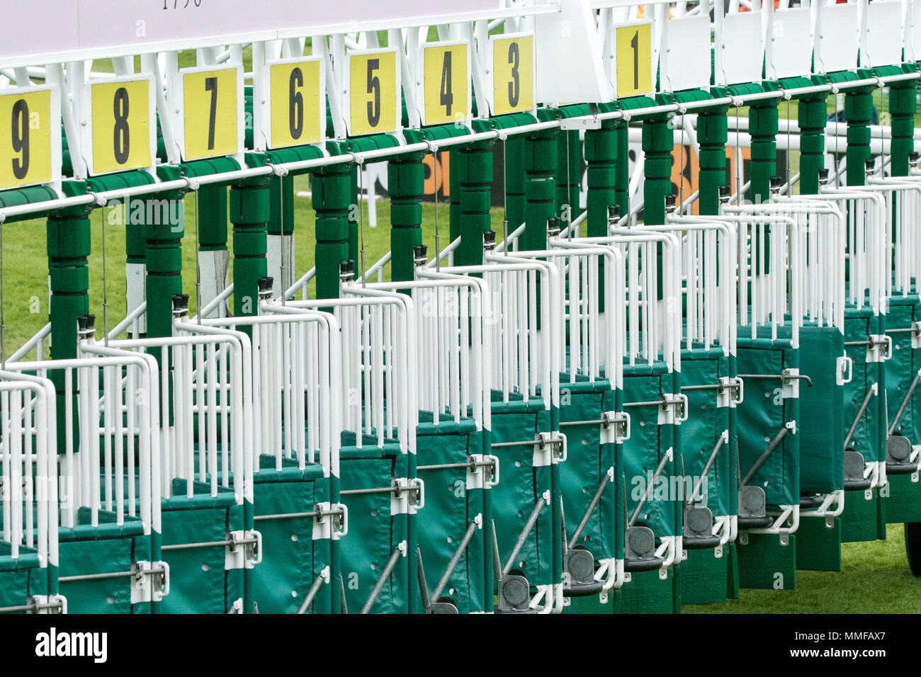 The starting stalls being checked and prepared for horse racing on the ...