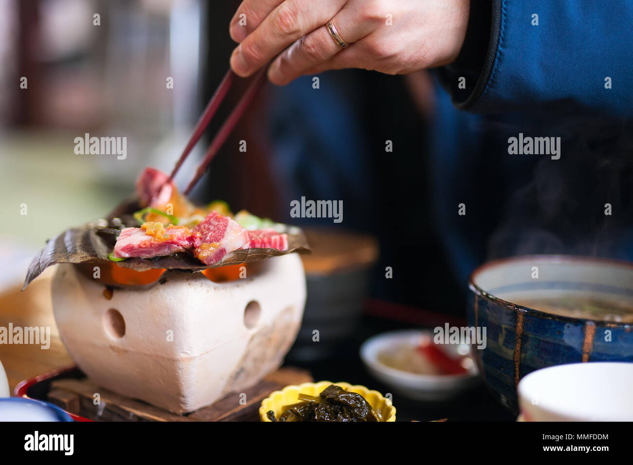 Traditional Japanese lunch with hida beef prepared on grill Stock Photo ...