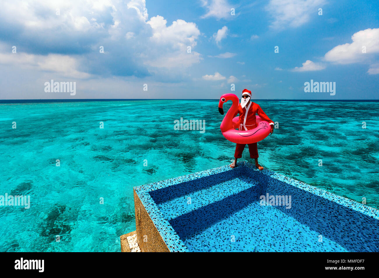 Christmas Santa Claus at tropical ocean luxury resort Stock Photo - Alamy