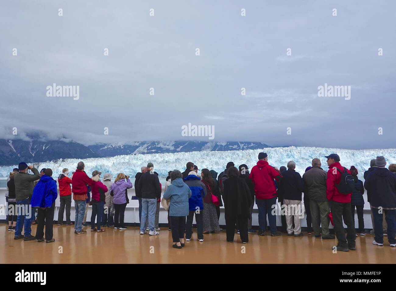 Disenchantment Bay, Alaska, USA: Passengers on the bow of a cruise ship ...