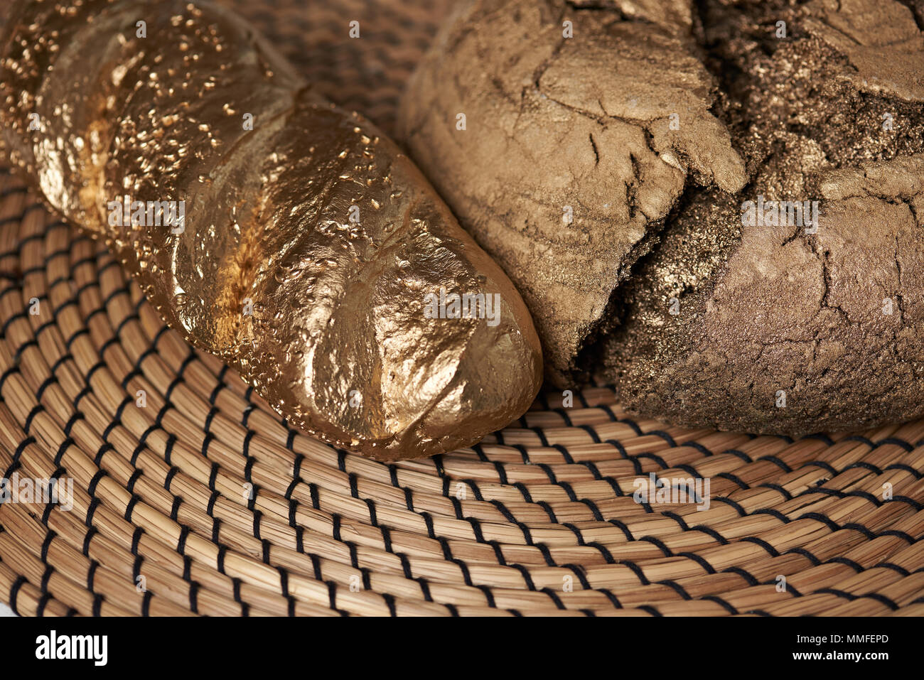 Gold bakery theme. Concept of golden food. Gold baguette Stock Photo ...