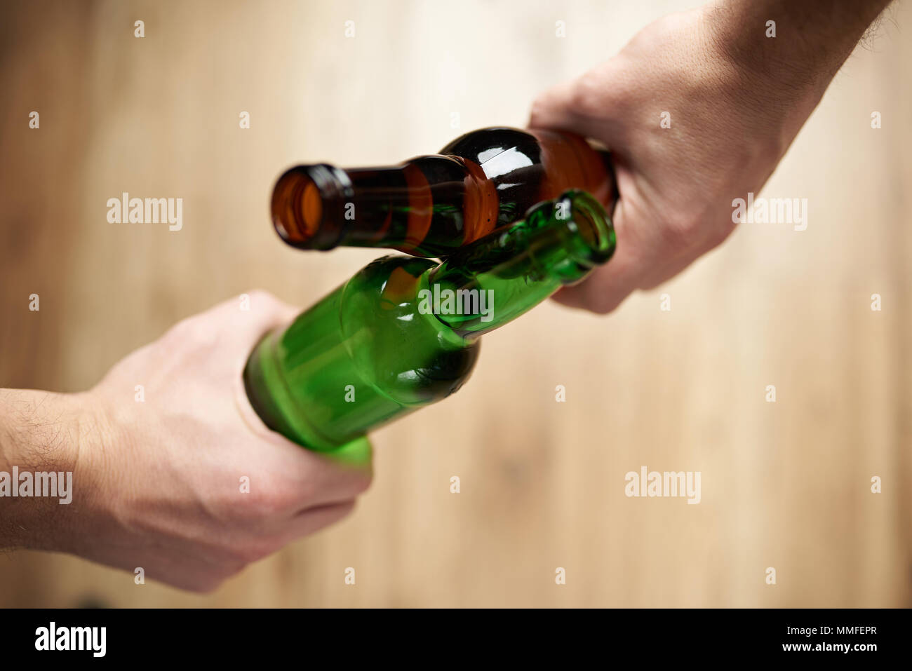 Hands hold beers hi-res stock photography and images - Alamy