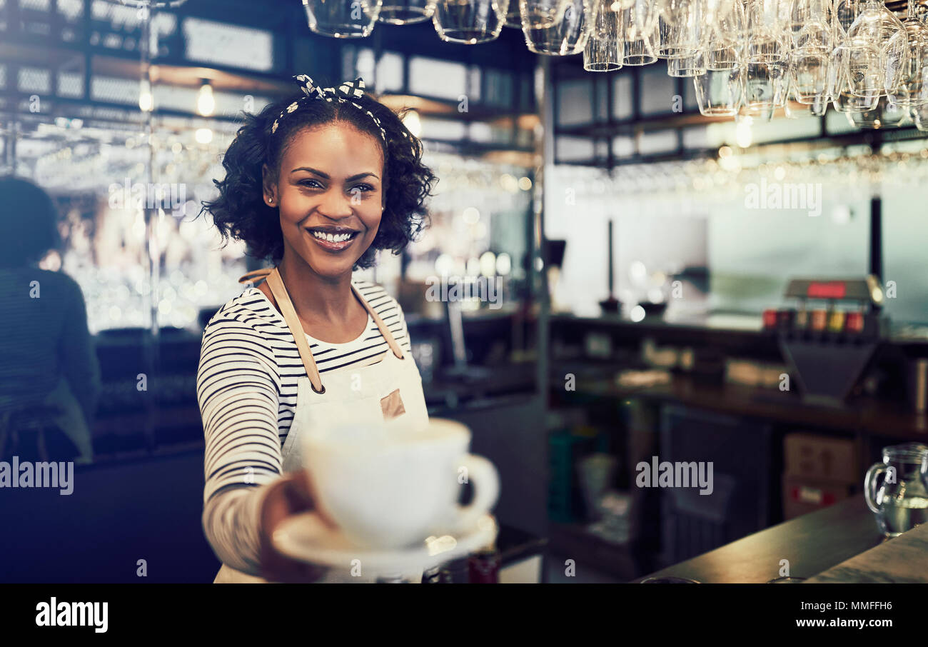 Standing behind the counter hi-res stock photography and images - Alamy