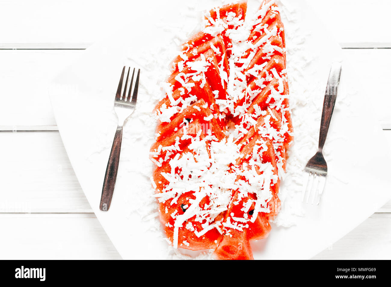 Fresh sliced of red watermelon sprinkle with freshly grated parmesan ...