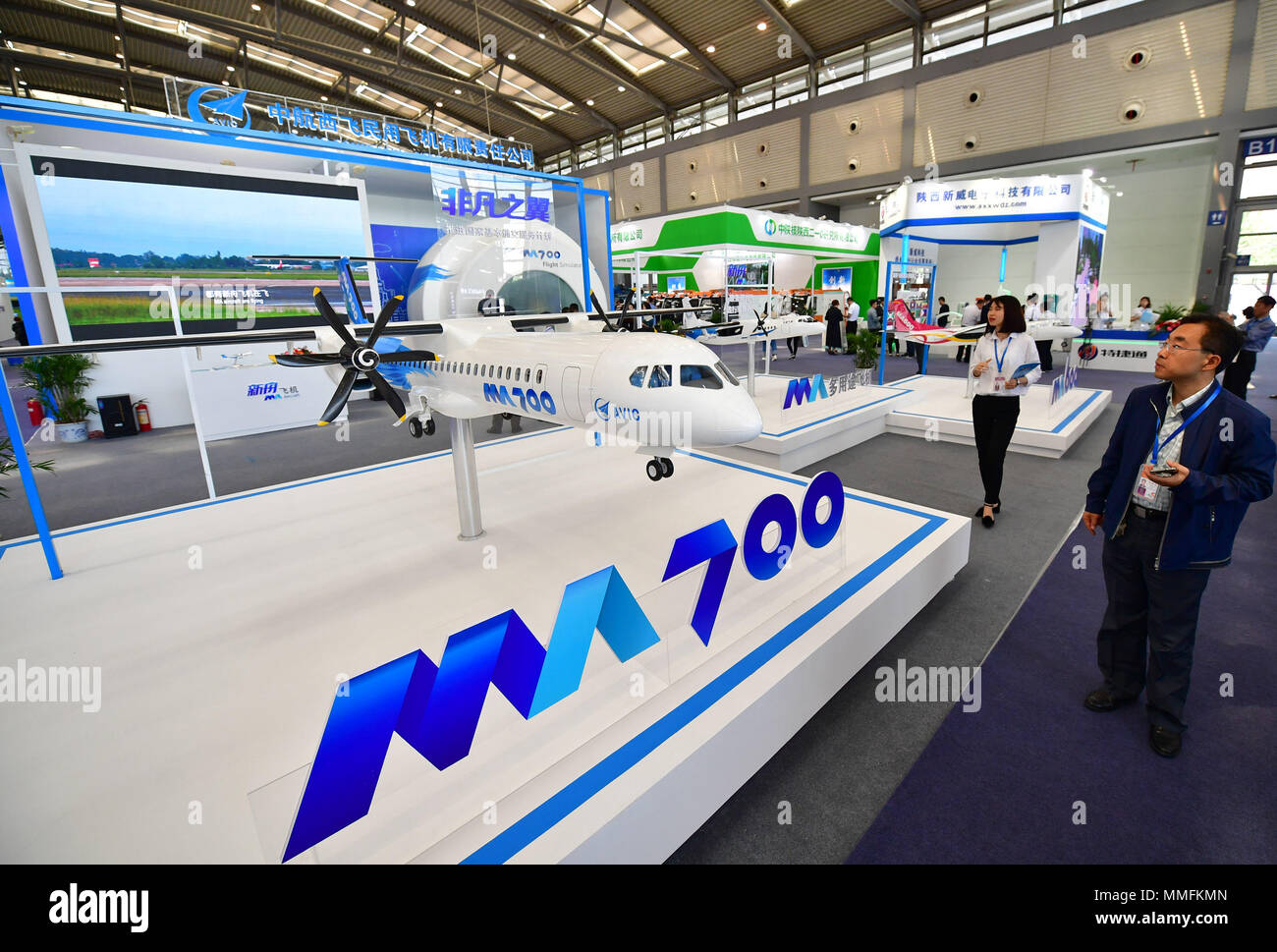 Xi'an, China's Shaanxi Province. 11th May, 2018. People look at a model ...