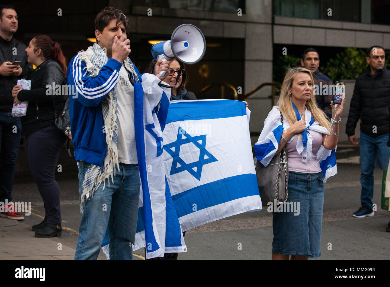 London, UK. 11th May, 2018. Pro-Israel activists stage a small counter ...