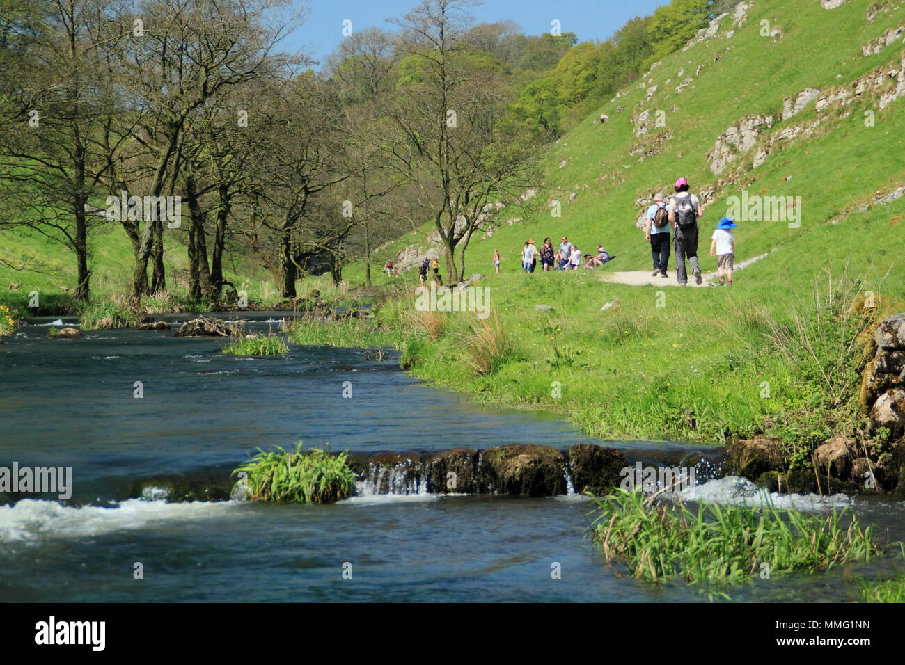 Walkers on public footpath by the River Dove in Wolfscote Dale, Peak ...