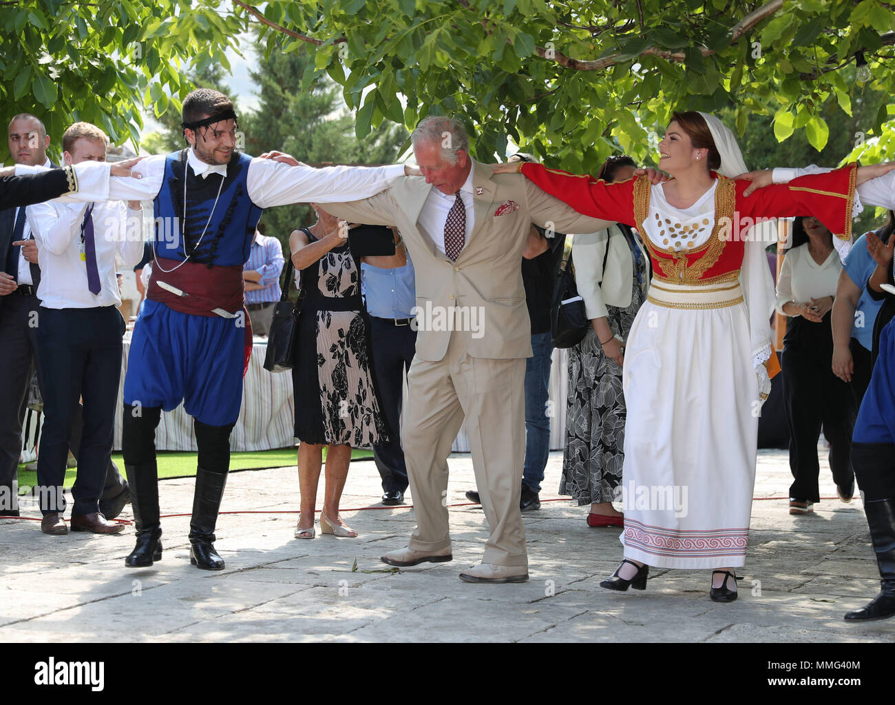 The Prince of Wales tries his hand at Greek dancing as he tours stalls ...