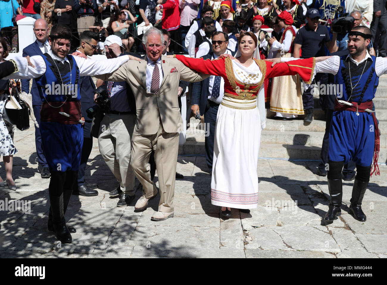 The Prince of Wales tries his hand at Greek dancing as he tours stalls ...