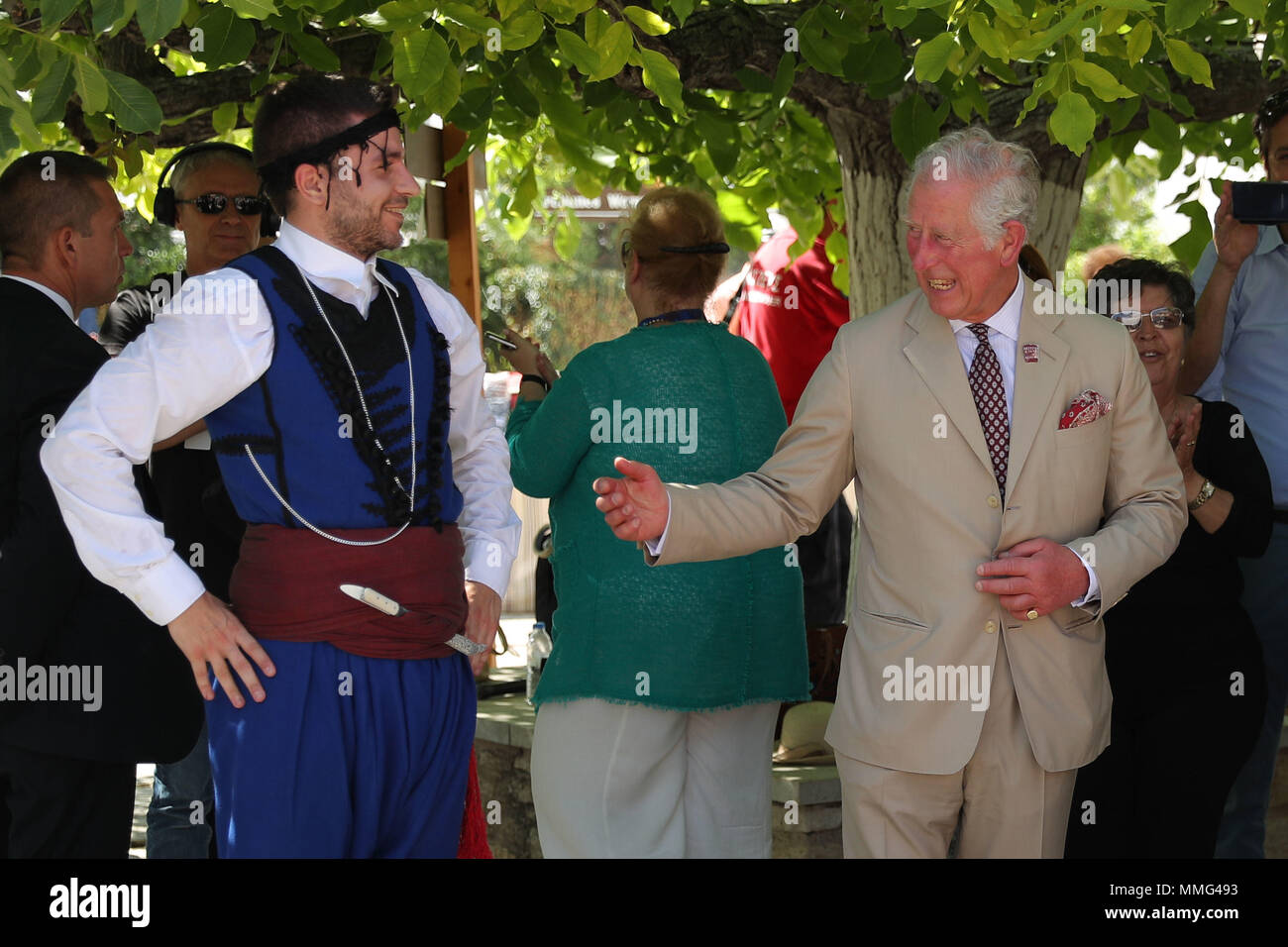 The Prince of Wales tries his hand at Greek dancing as he tours stalls ...