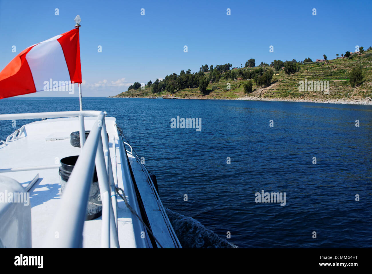 Boat ride with Waving Flag Stock Photo - Alamy