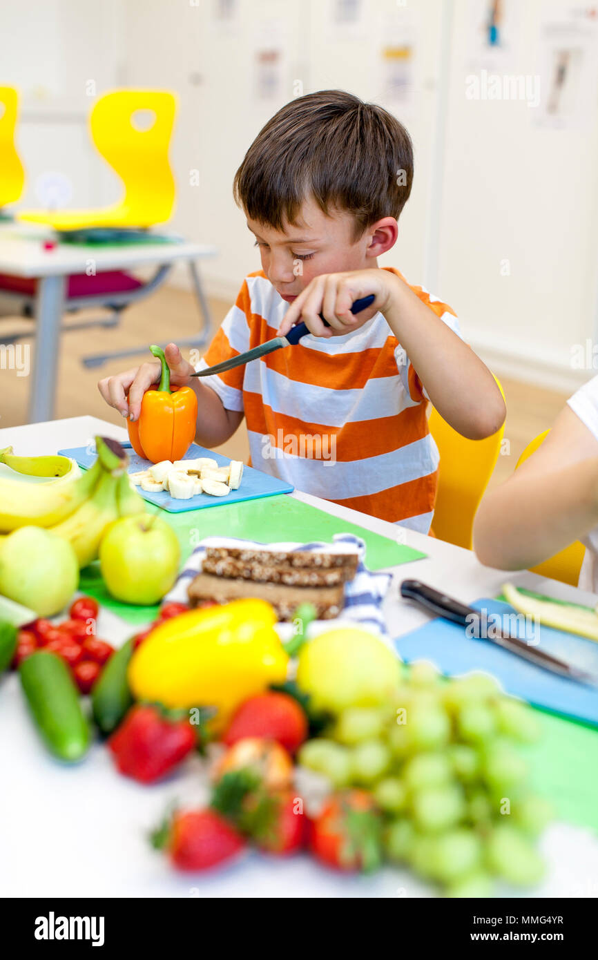 At school - Happy pupil prepare a healthy snack for the break Stock ...