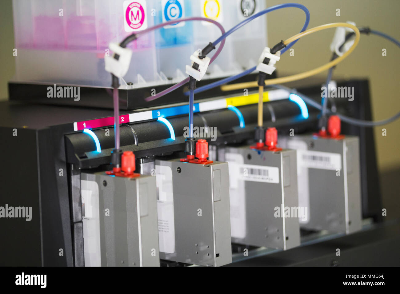 Color ink cartridges inside professional printing machine Stock Photo ...