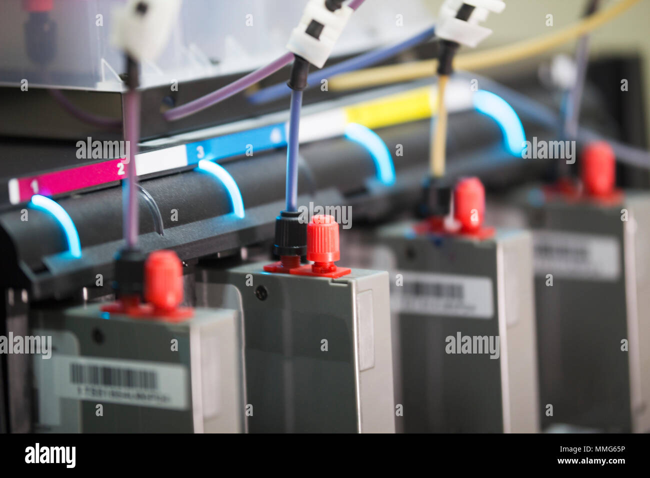 Ink cartridges inside modern professional printing machine Stock Photo ...
