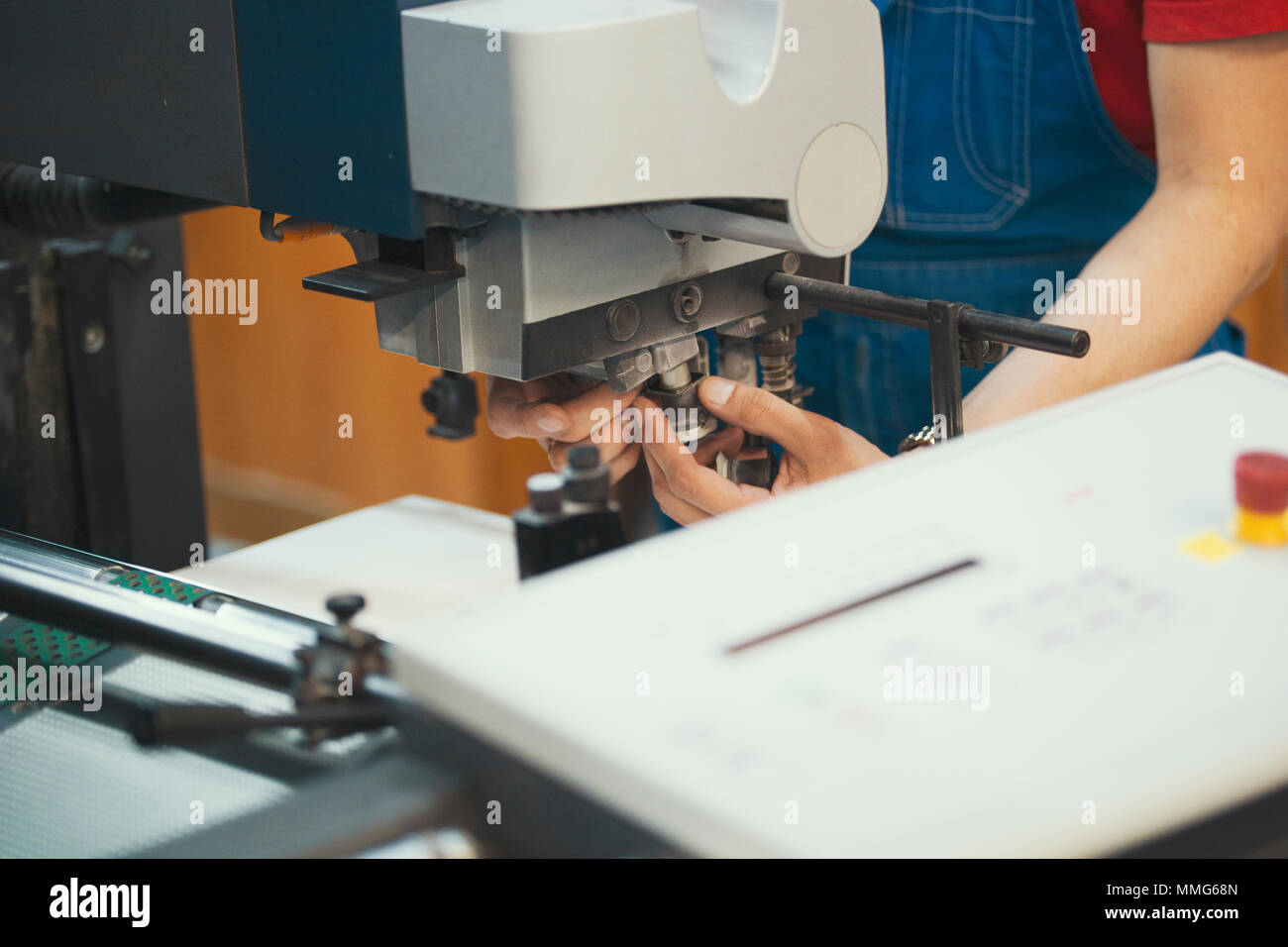 Hands of person working with machinery printing equipment Stock Photo ...