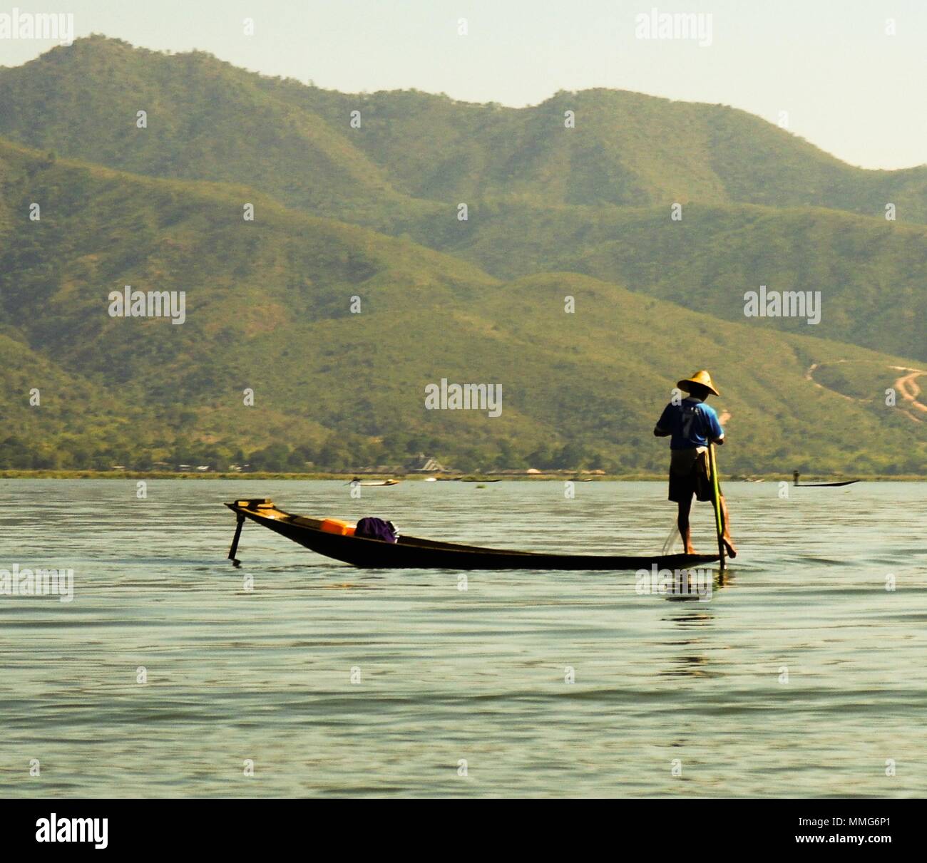 Fisherman on the boat, Inle lake, Myanmar Stock Photo - Alamy