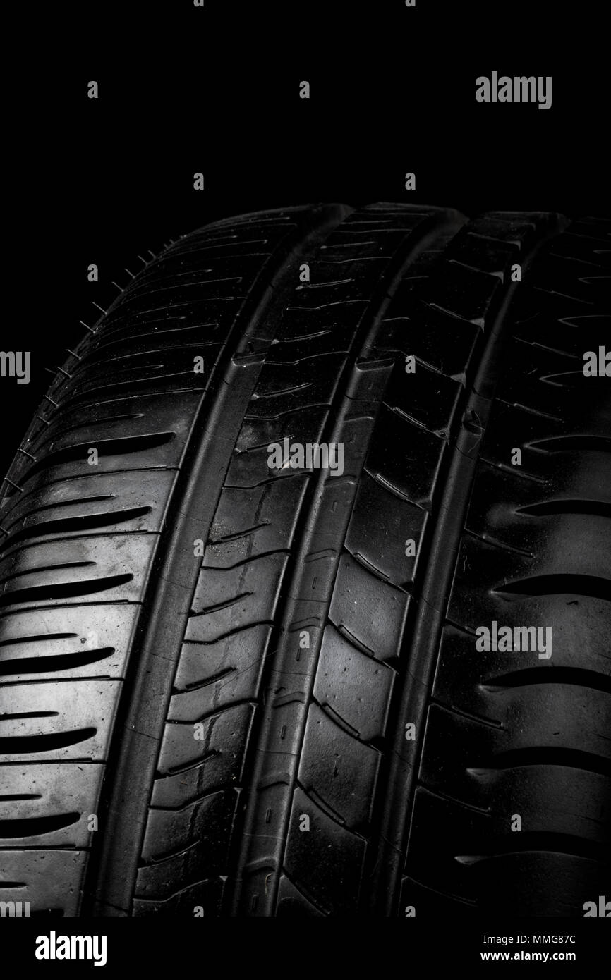 Close up view of a car tyre isolated on a black background Stock Photo ...