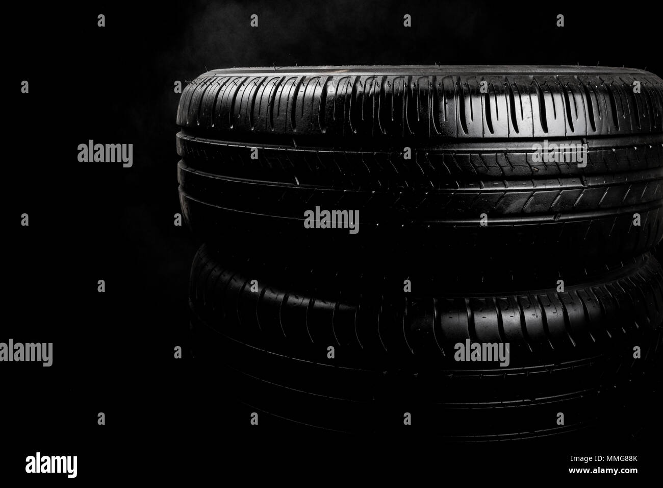 Close up view of a car tyre isolated on a black background Stock Photo ...