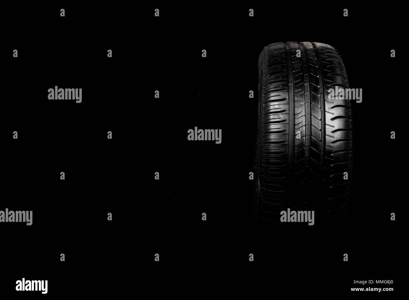 Close up view of a car tyre isolated on a black background Stock Photo ...