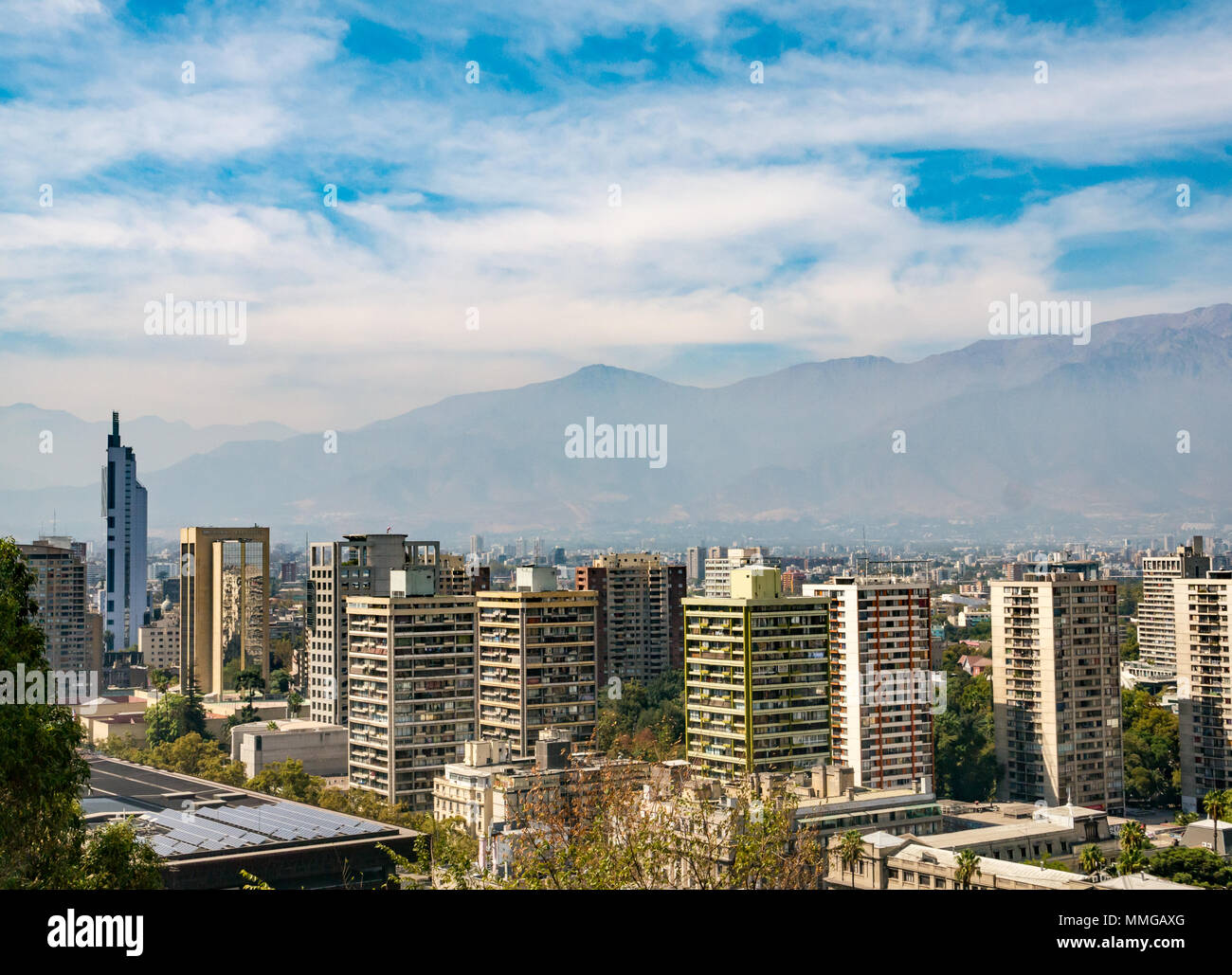 Cityscape of apartment buildings, telephone tower, Andes foothills and ...