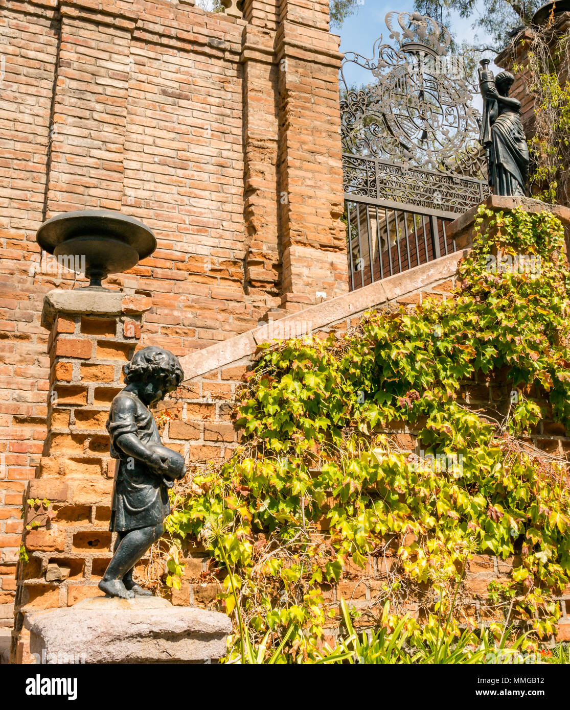 Statue of small boy and female figure, steps in Santa Lucia park and ...