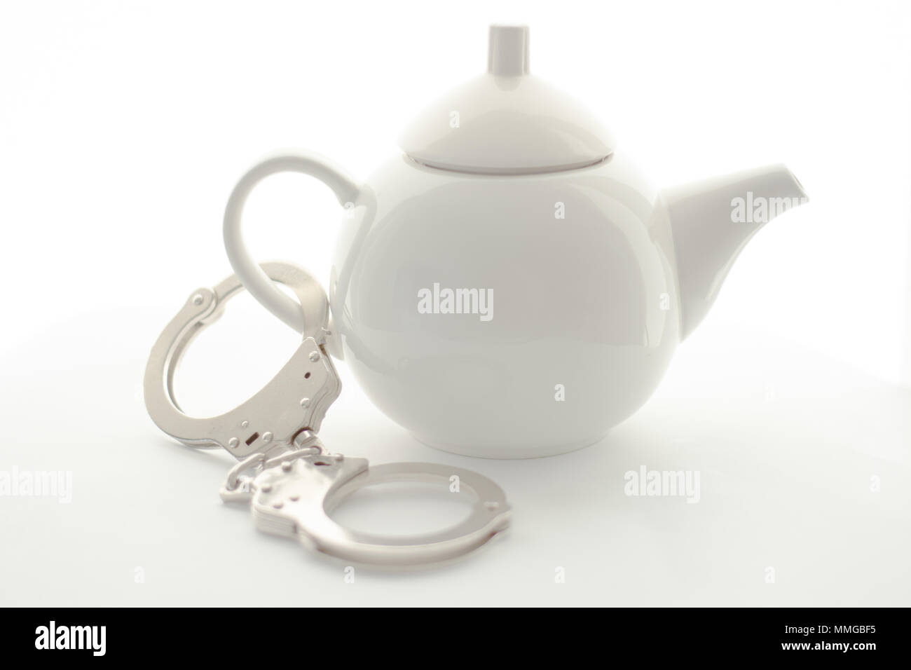 Handcuff with tea Stock Photo - Alamy