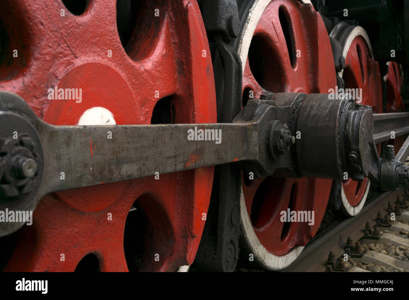 wheels of an old functioning steam locomotive with drawbar and crank ...