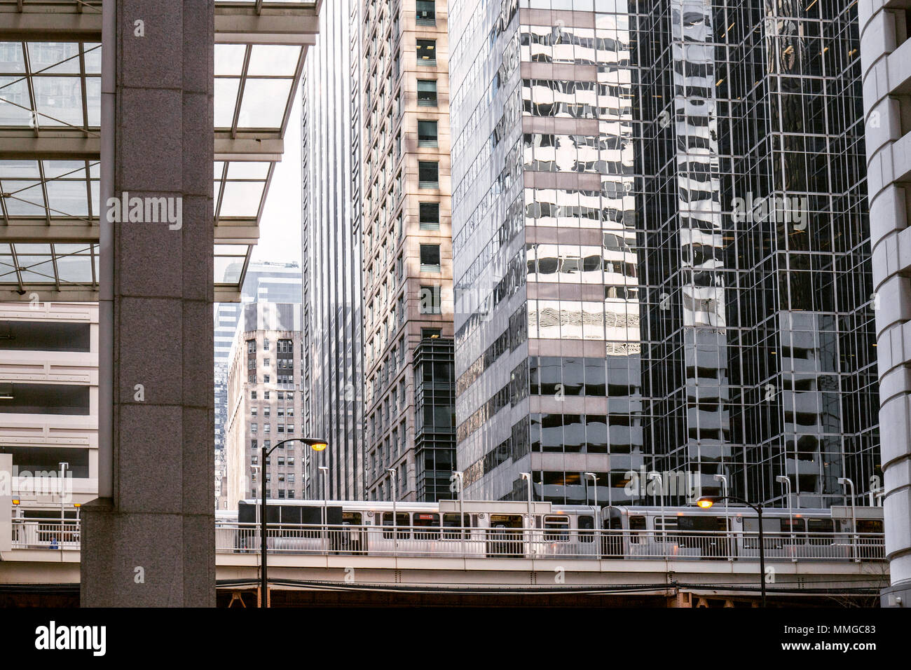 metro station on the bridge in downtown Chicago surrounded by ...