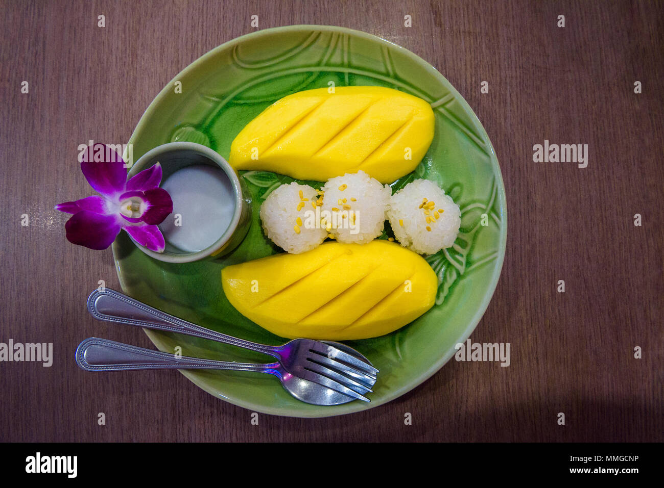 Fresh mango and sticky rice served with coconut milk syrup Stock Photo ...