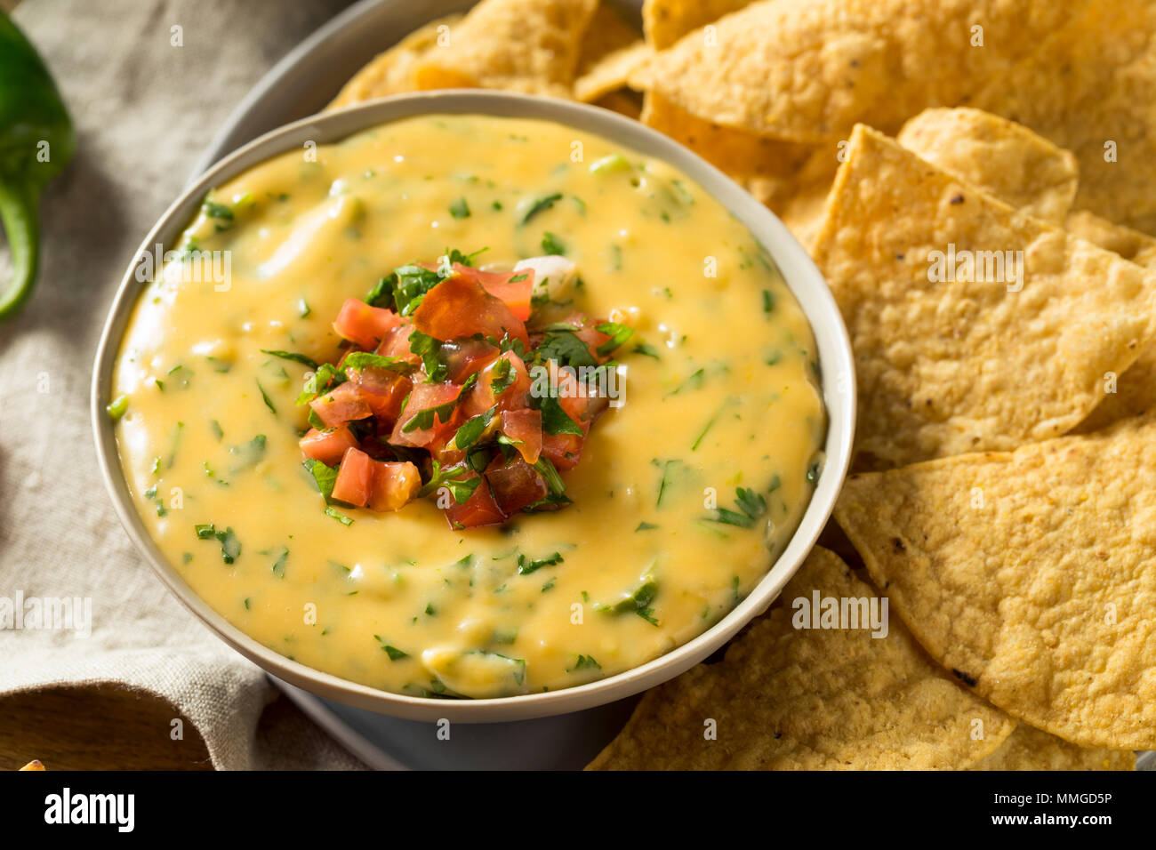 Spicy Homemade Cheesey Queso Dip with Tortilla Chips Stock Photo - Alamy