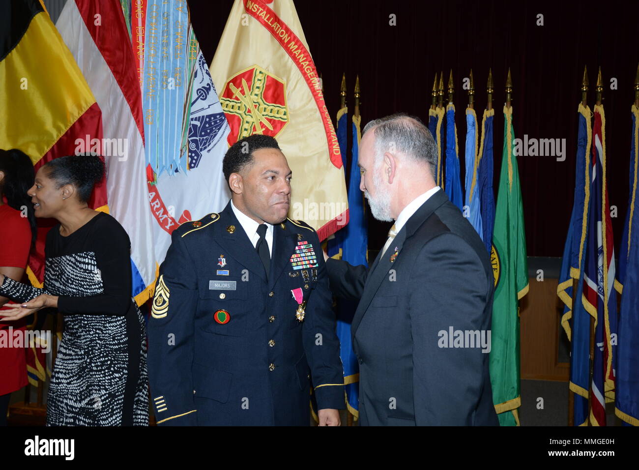 U.S. Army Command Sgt. Maj. William Majors, receives a congratulations ...