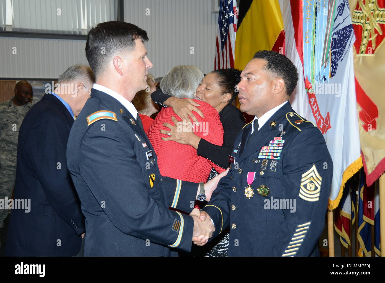 U.S. Army Command Sgt. Maj. William Majors, receives a congratulations ...