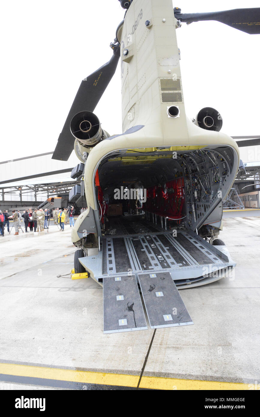 Soldiers show people the loading area of a CH-47 Chinook helicopter ...