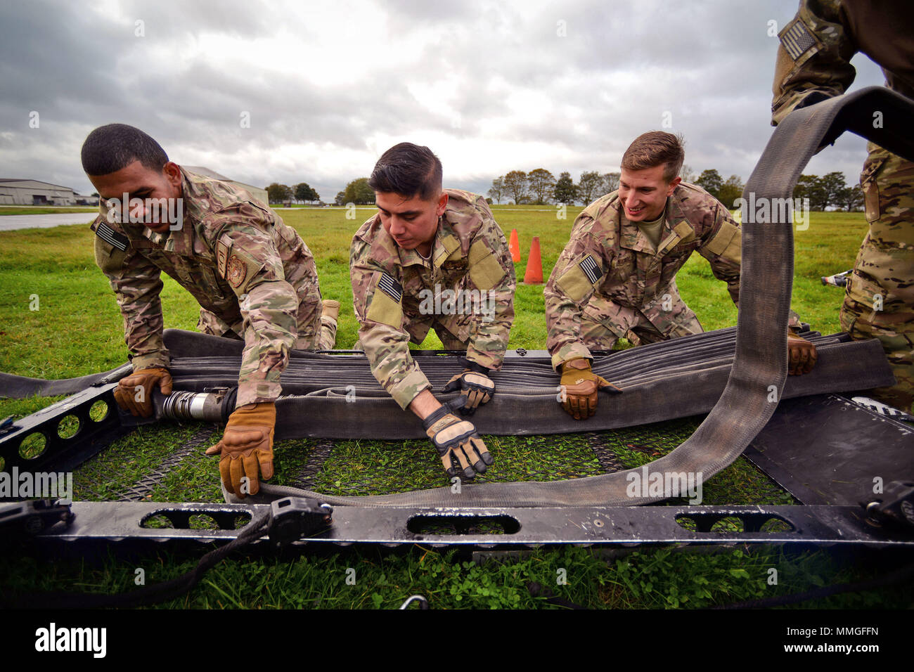 U.S. Air Force Airman 1st Class Sequan Gill, Tech. Sgt. Roberto Flores ...