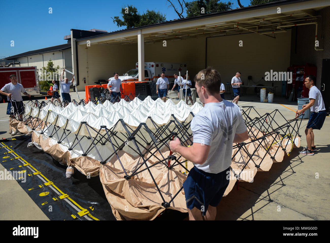 Members of the 81st Medical Group assemble a decontamination tent ...