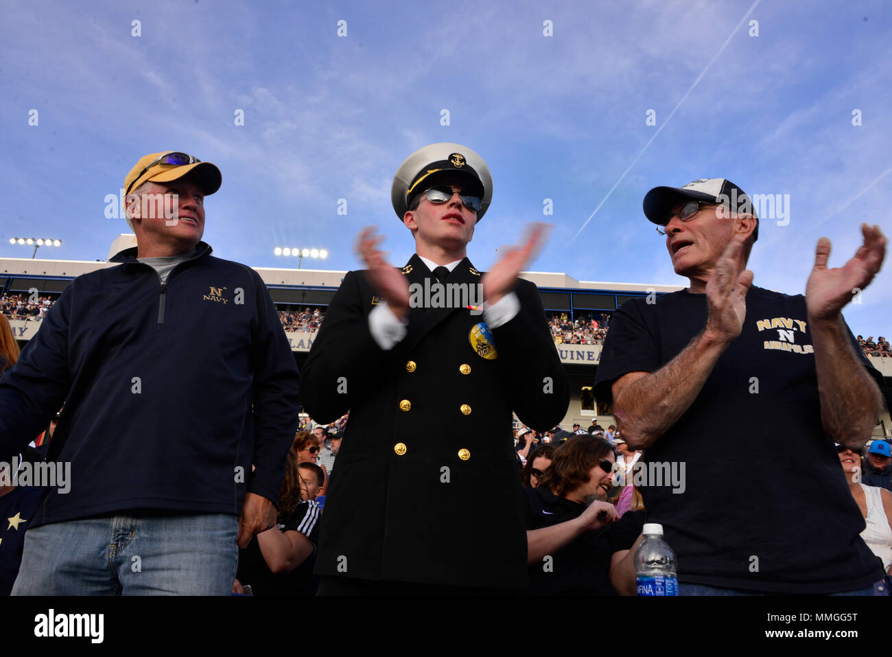 Fans of the U.S. Naval Academy football team, the Midshipmen, cheer at ...